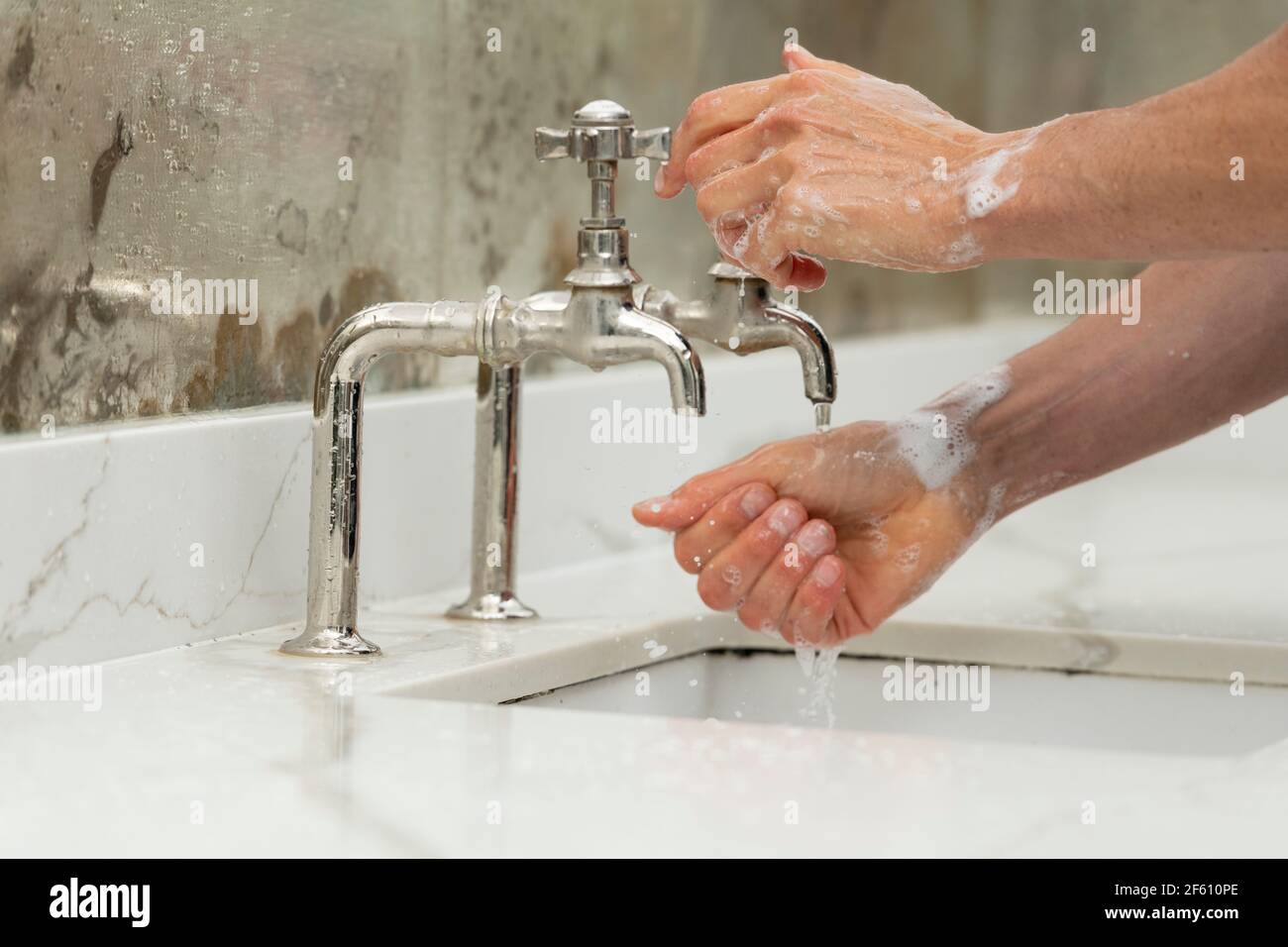 Person washing hands hi-res stock photography and images - Alamy