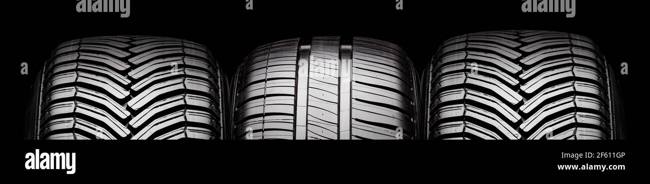 summer and all-season tires, front view tread on black background Stock ...