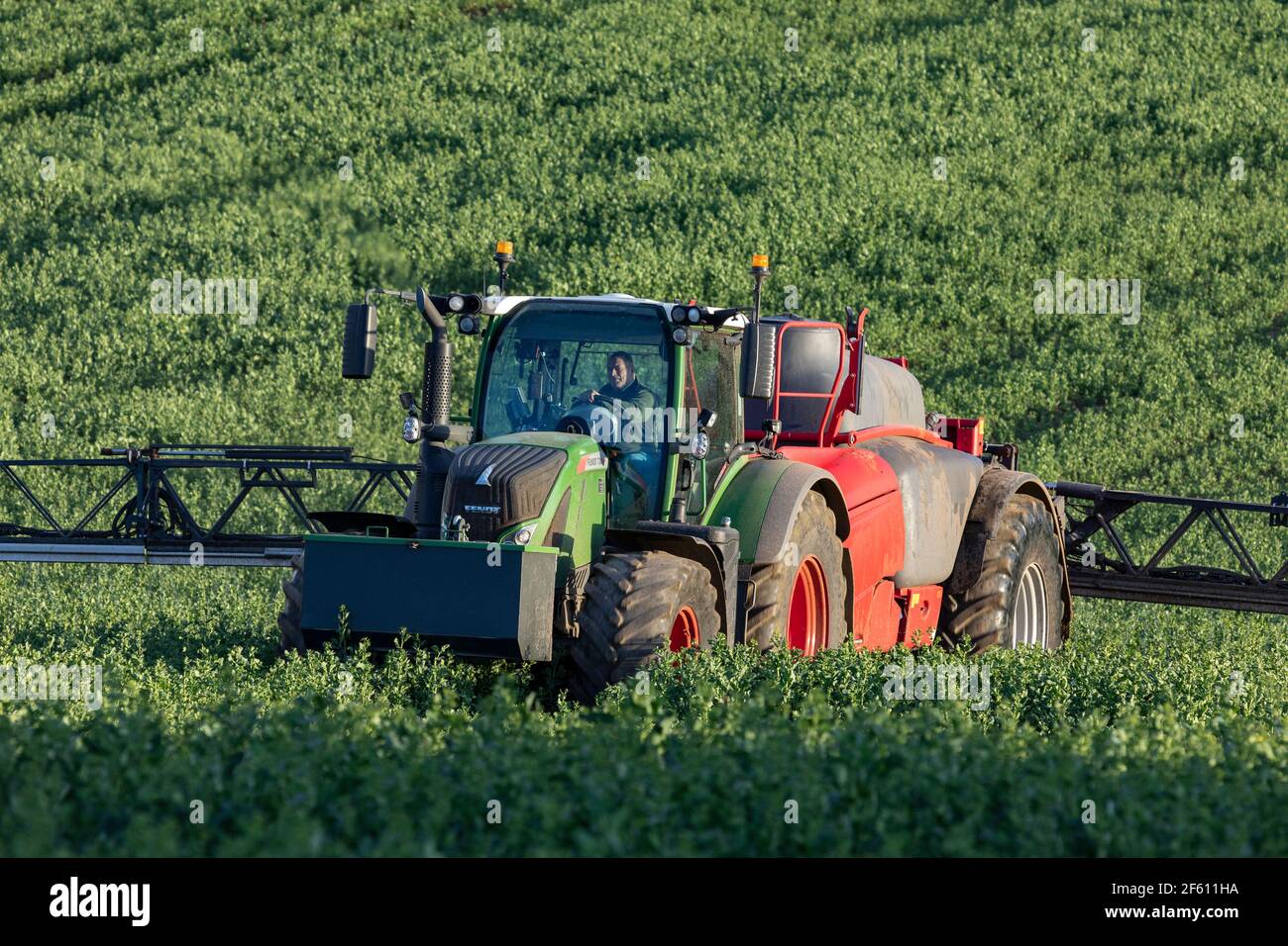 Agriculture - A farmer spraying fertilizer on his crops - North ...