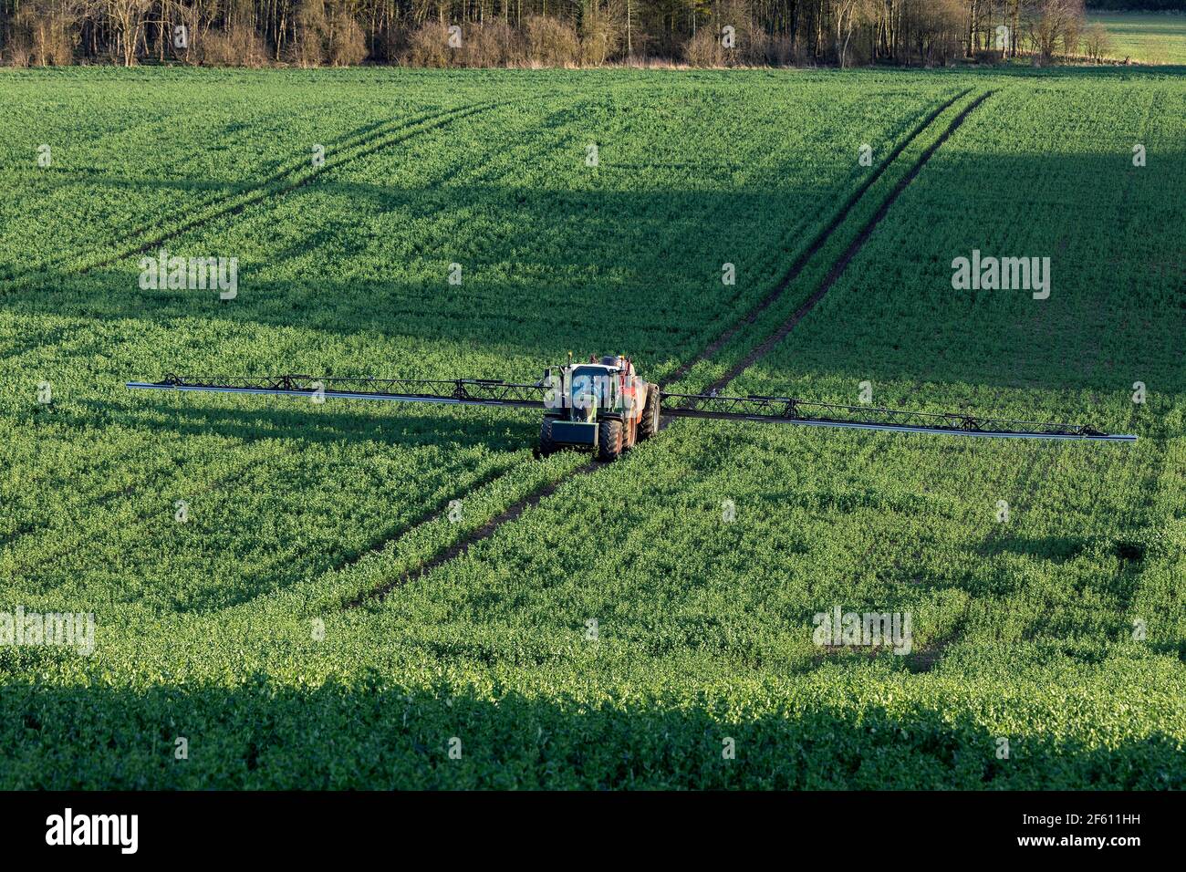 Agriculture - A farmer spraying fertilizer on his crops - North ...
