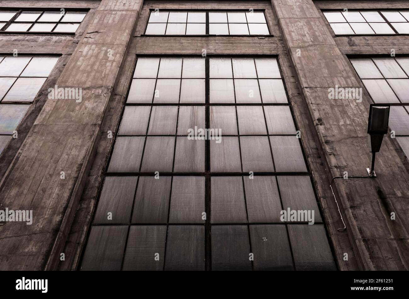 Dirty windows at abandoned industry building Stock Photo - Alamy