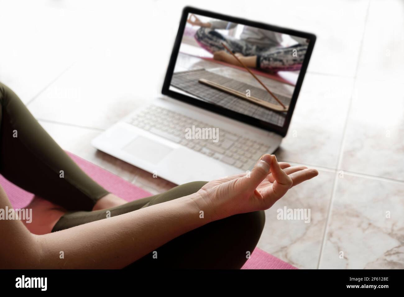 Online yoga sport fitness training concept.Woman in lotus position ...
