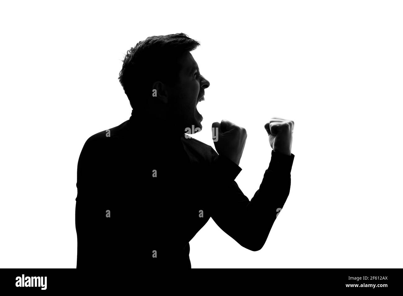 Irritated angry mad millennial guy clenching hands in fists ...