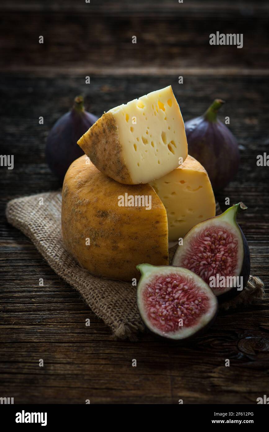 Raw milk cheese with figs Stock Photo - Alamy