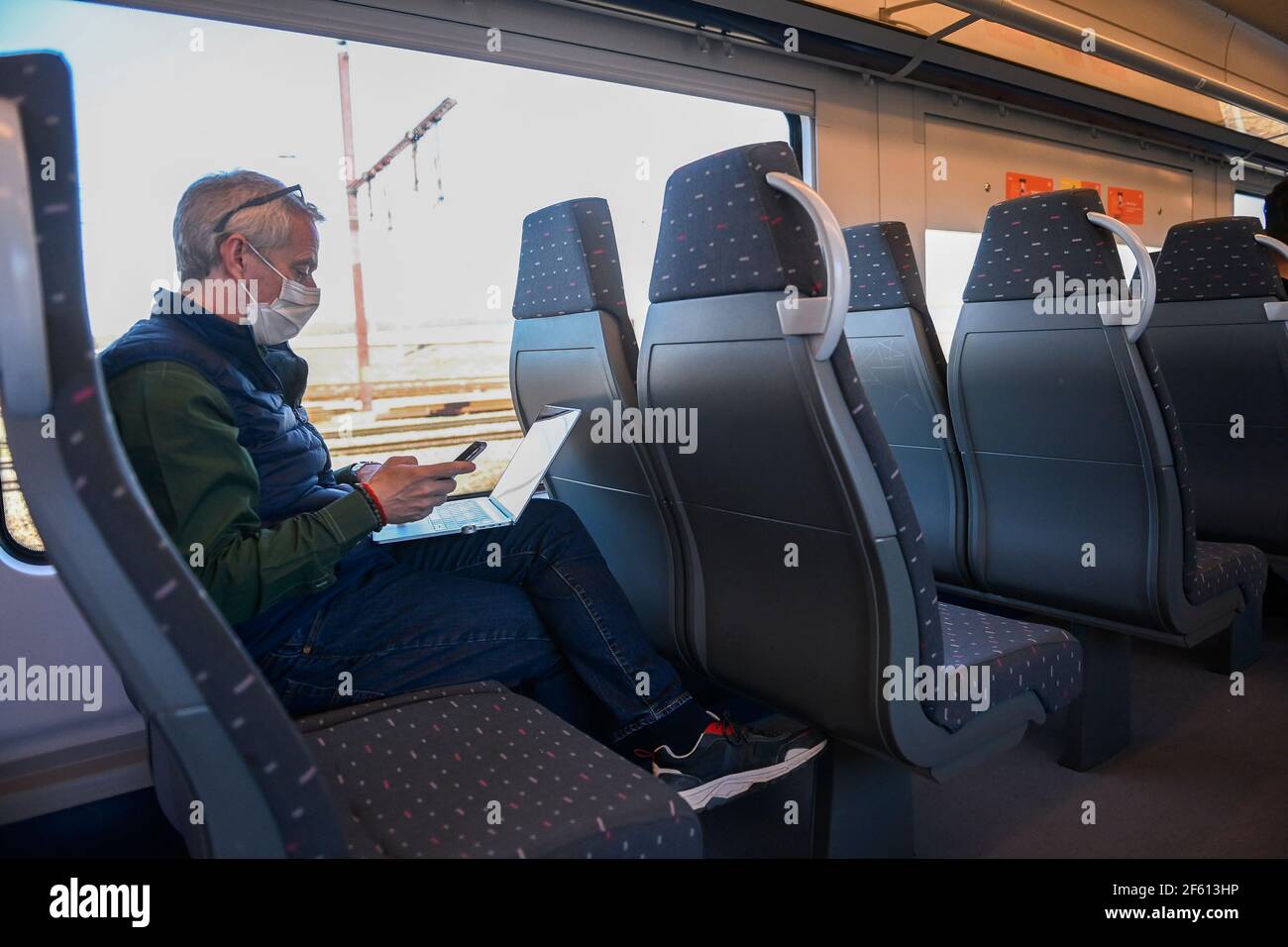 Illustration picture shows a person sitting by the window, in a train ...