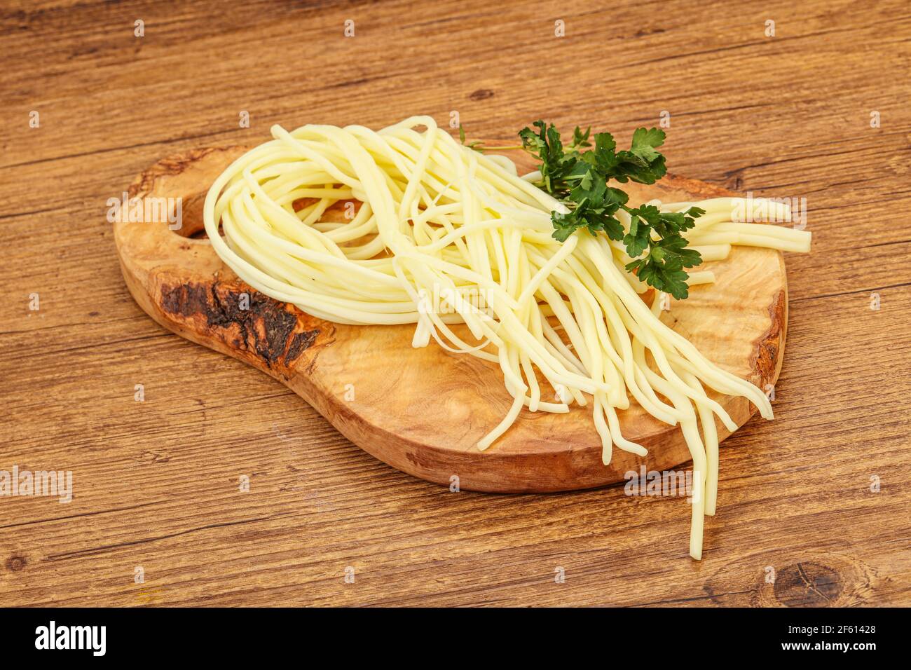 Chechil spaghetti cheese snack over board Stock Photo - Alamy