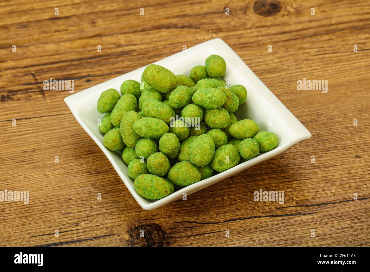 Spicy wasabi peanuts snack in the bowl Stock Photo - Alamy
