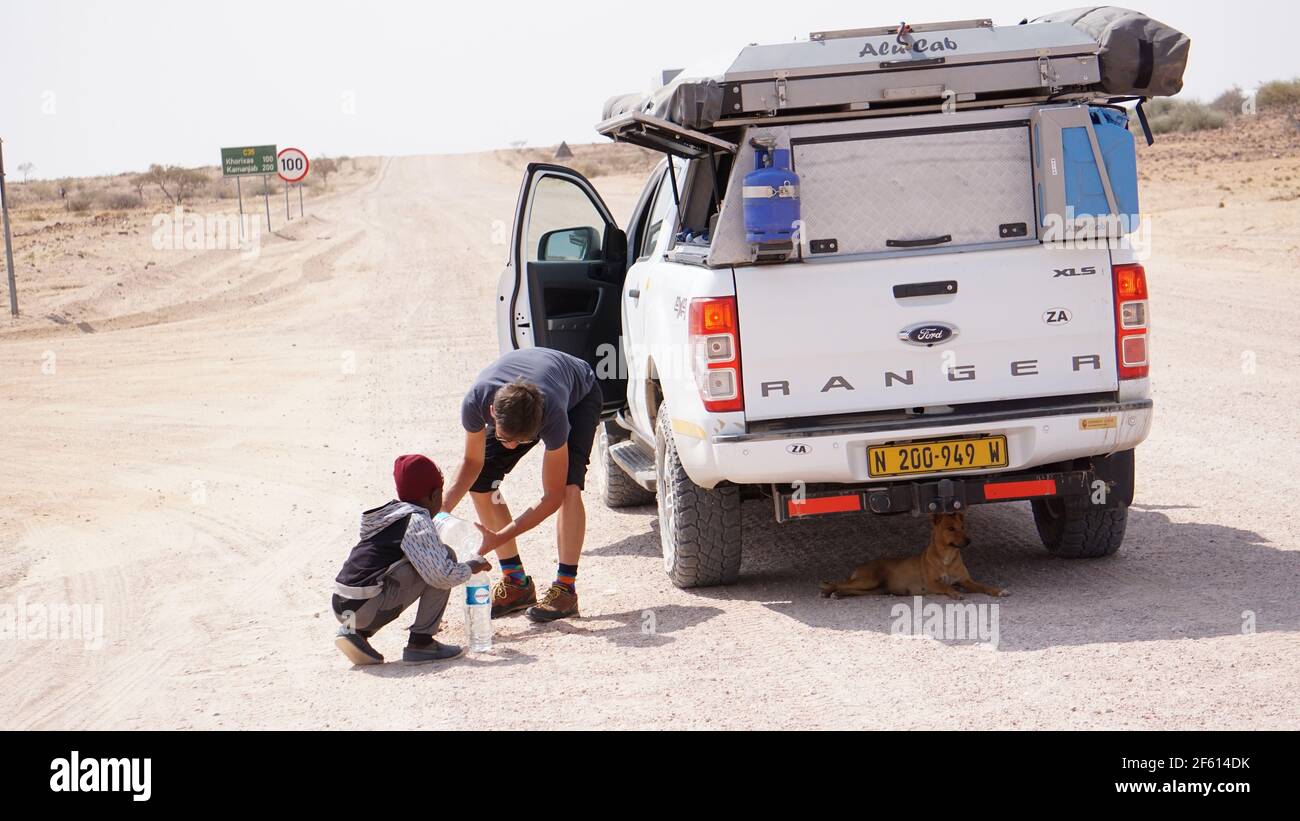 helping an african kid Stock Photo - Alamy