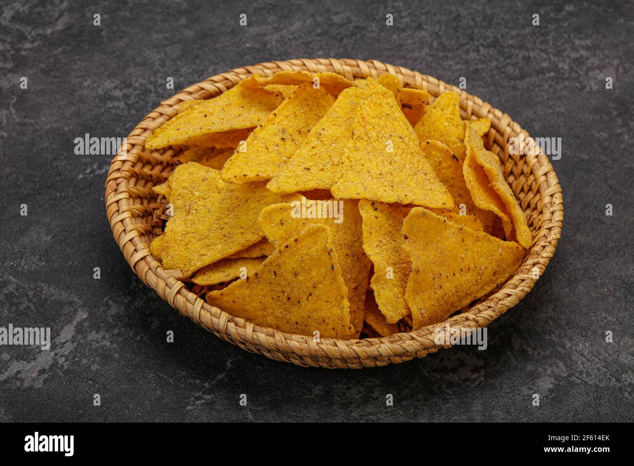Mexican crunchy corn nachos triangle heap Stock Photo - Alamy