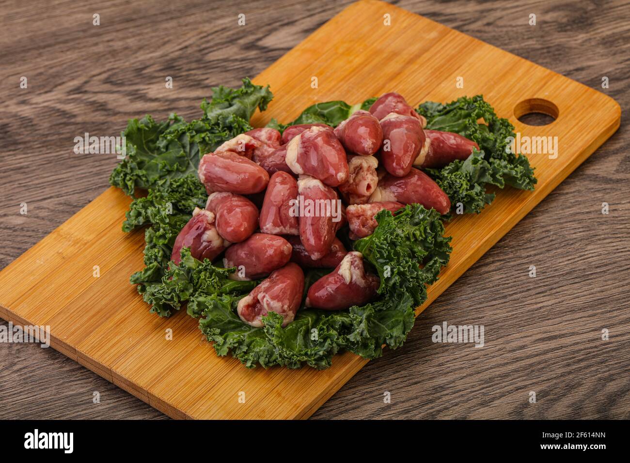 Raw chicken hearts heap for cooking Stock Photo - Alamy