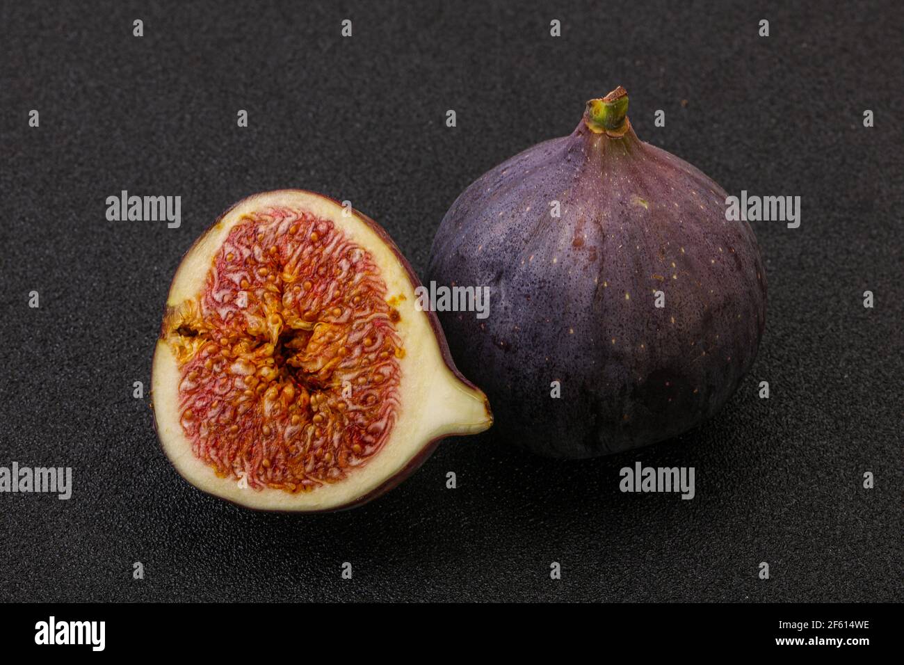 Sweet purple slice of fig fruit Stock Photo - Alamy