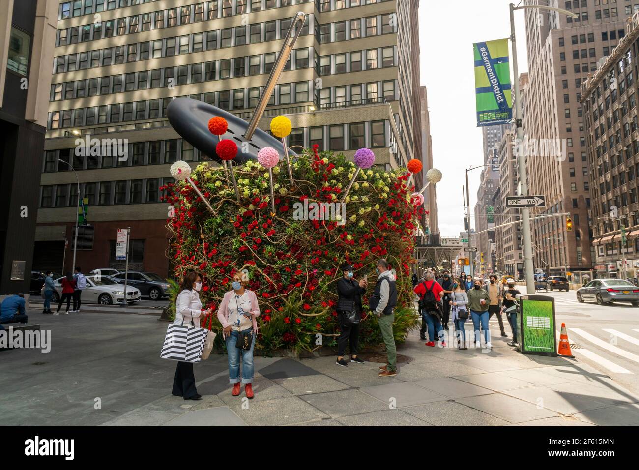 Visitors to the Garment District in New York interact with the floral ...