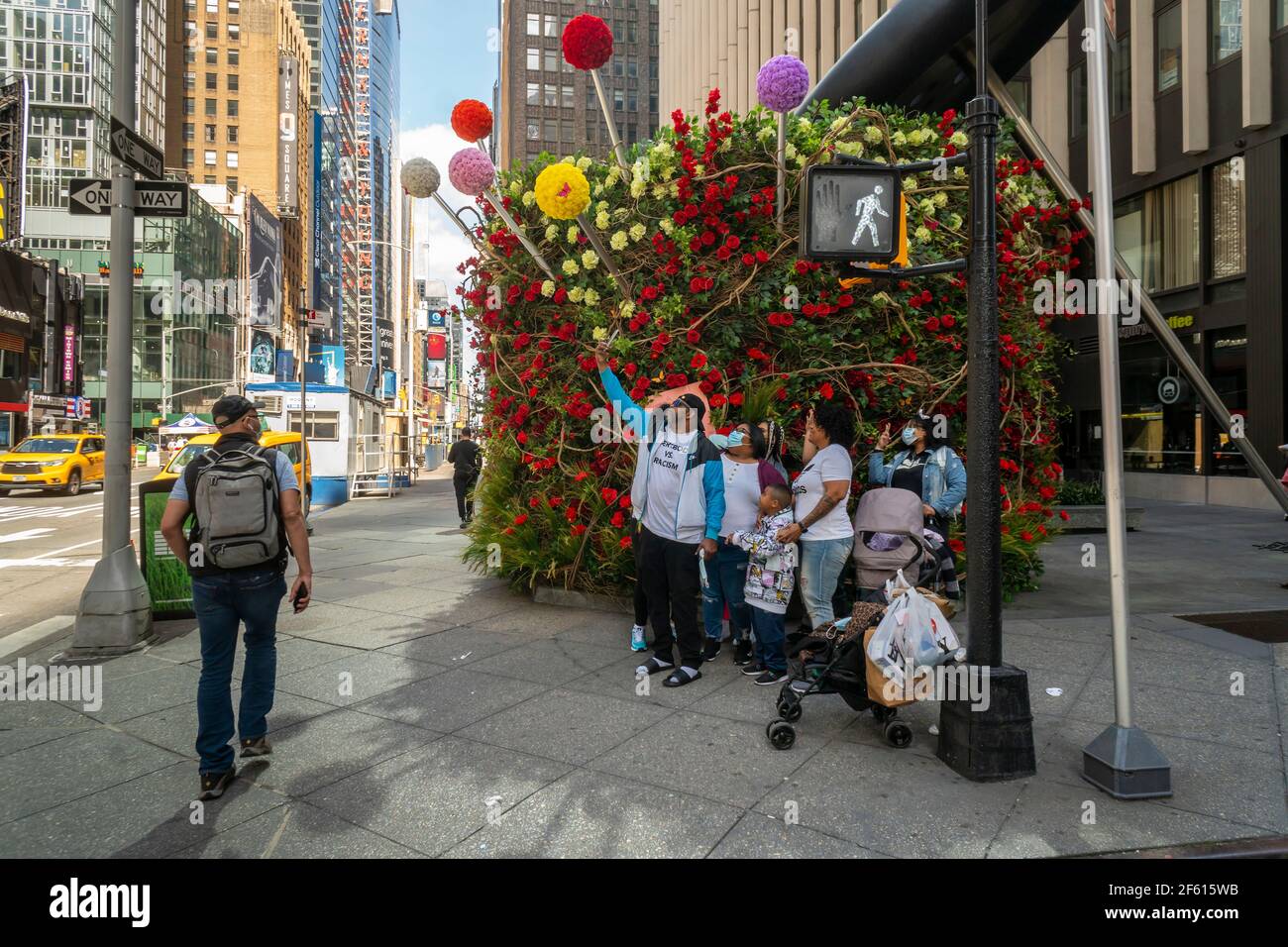 Visitors to the Garment District in New York interact with the floral ...