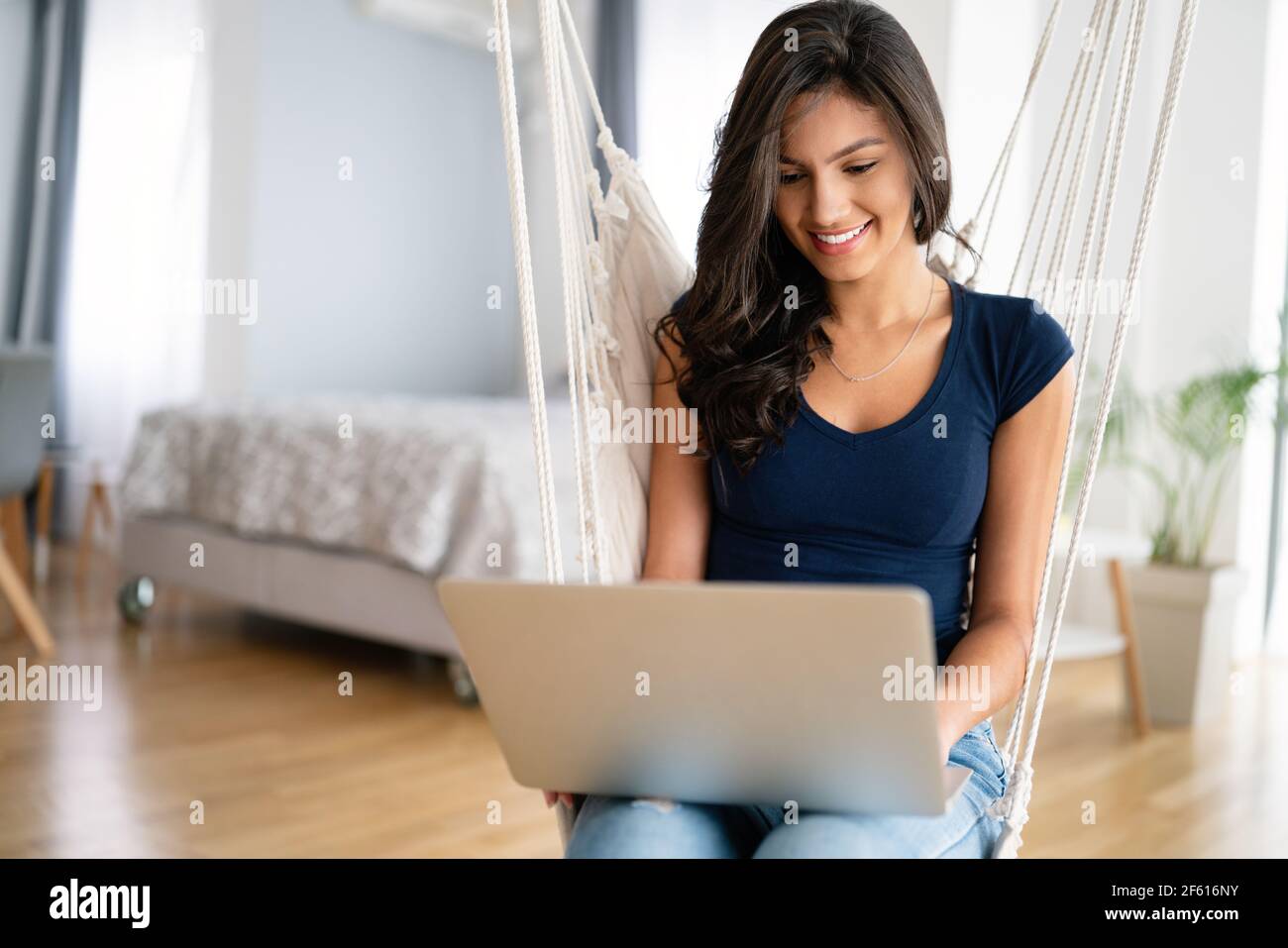 Happy beautiful woman using, working on computer. Technology, people ...