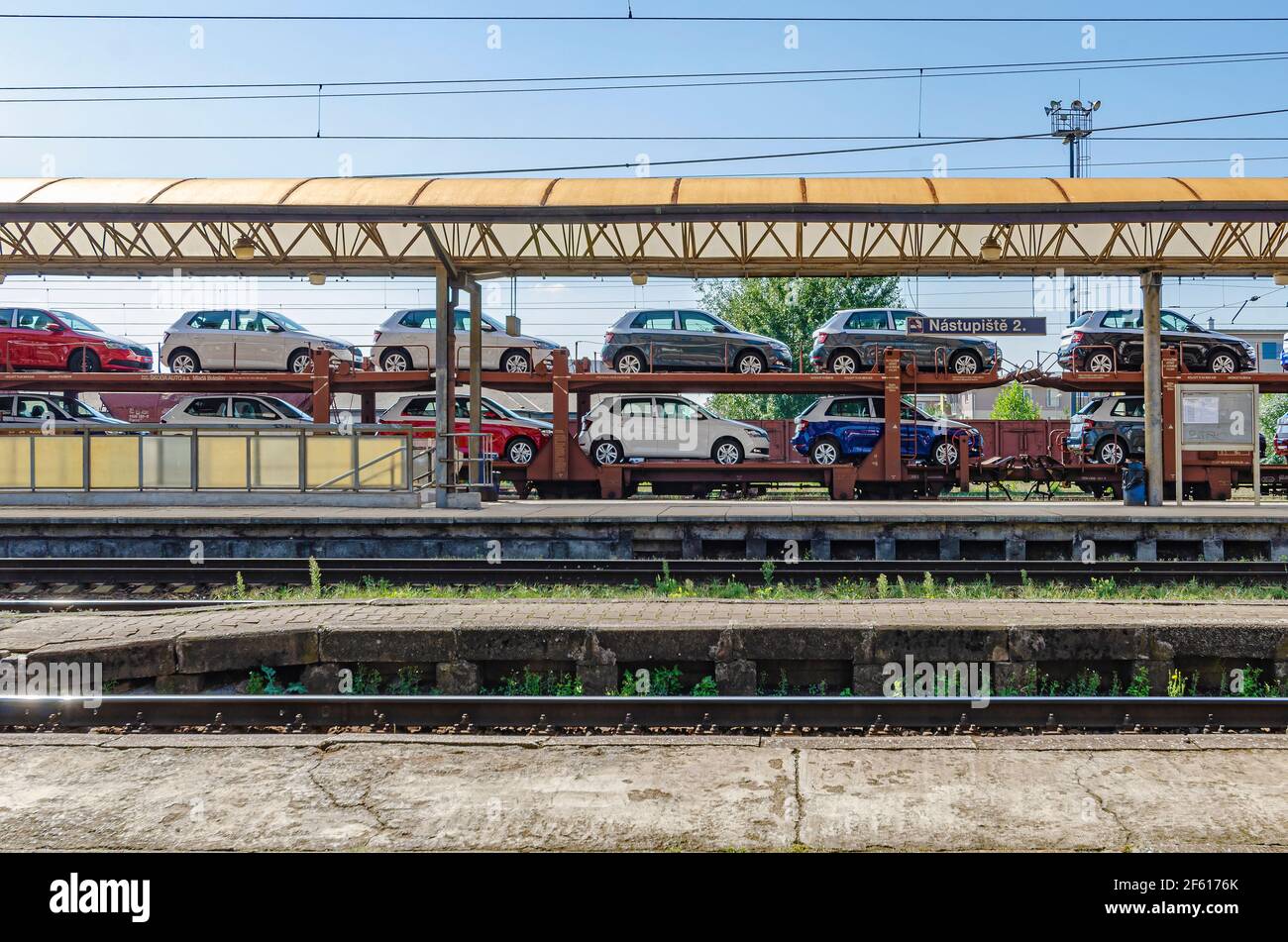 Cargo train loaded with Skoda Fabia cars, Lysa nad Labem train station ...