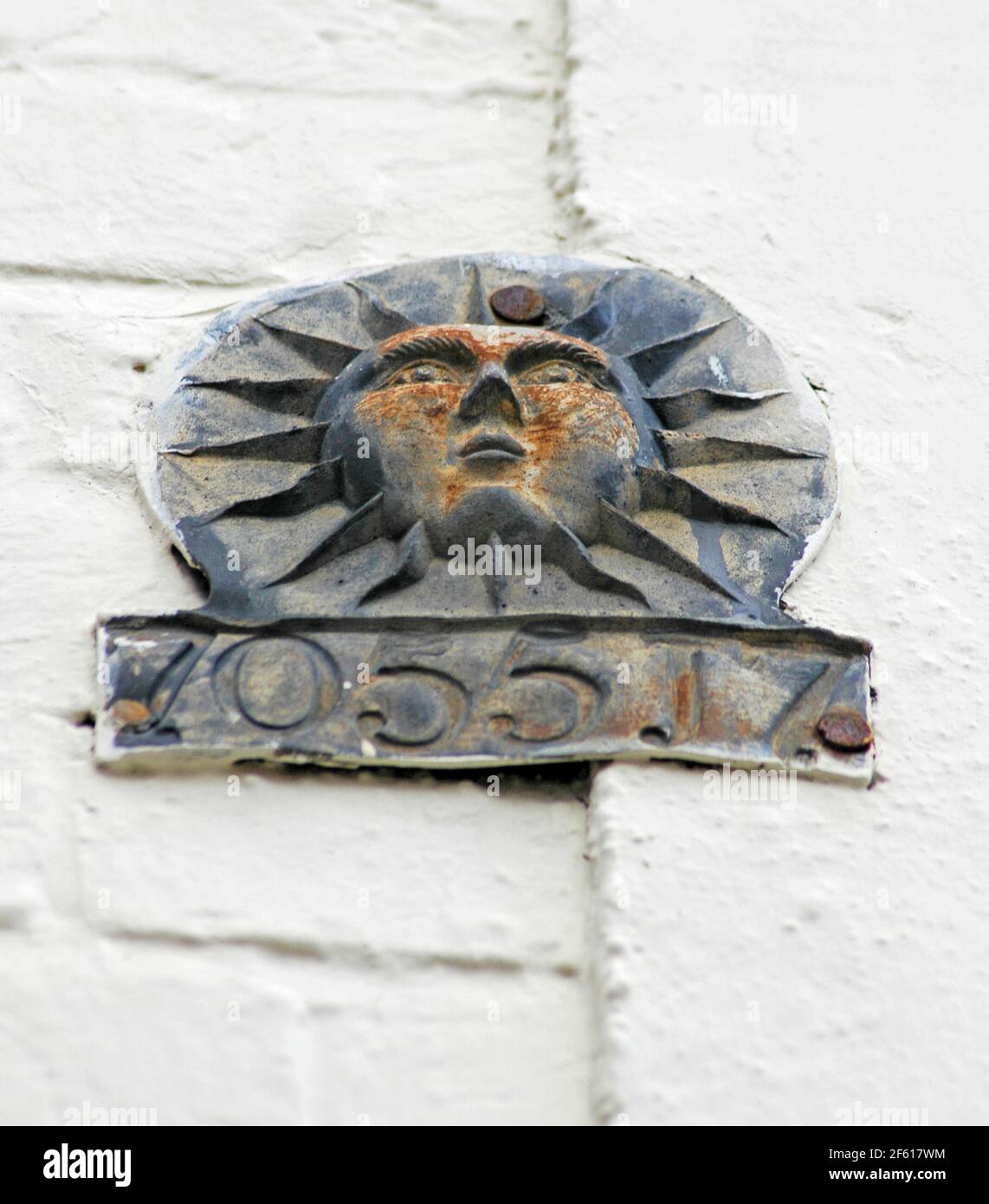 Sun firemark on outside wall of building in Chichester, West Sussex ...