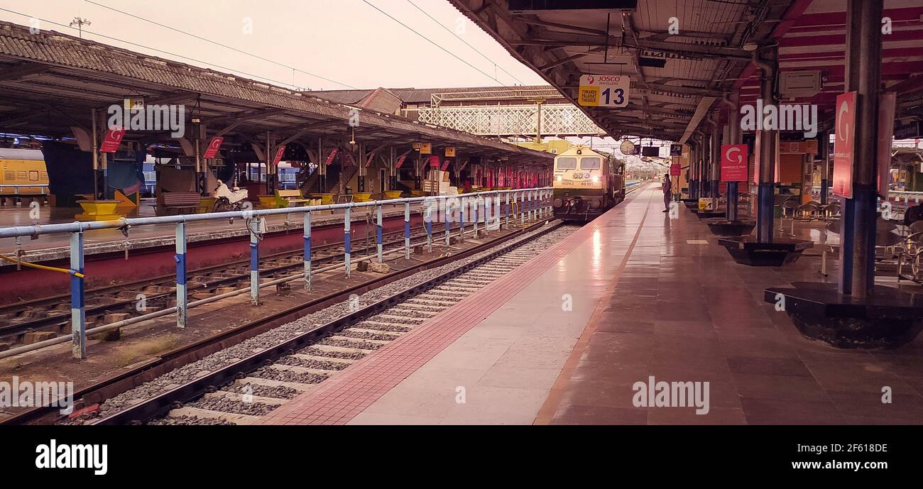 Red train engine at the platform in india Stock Photo - Alamy