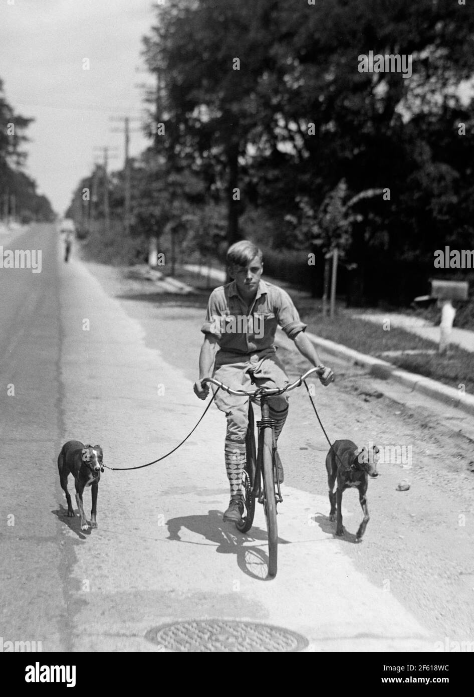 Boys with dogs Black and White Stock Photos & Images - Alamy
