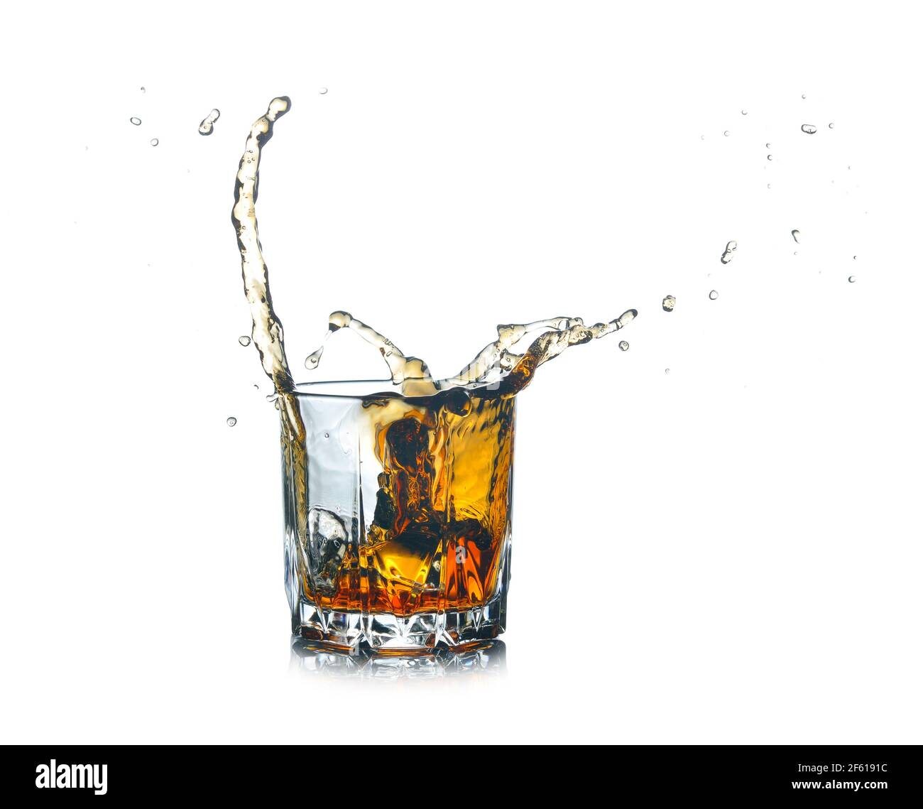 Whiskey splash out of glass isolated on white background Stock Photo ...