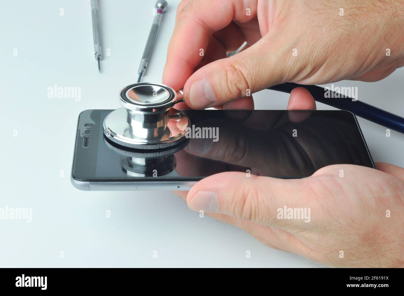 Men using a stethoscope for phone examination with empty copy space ...