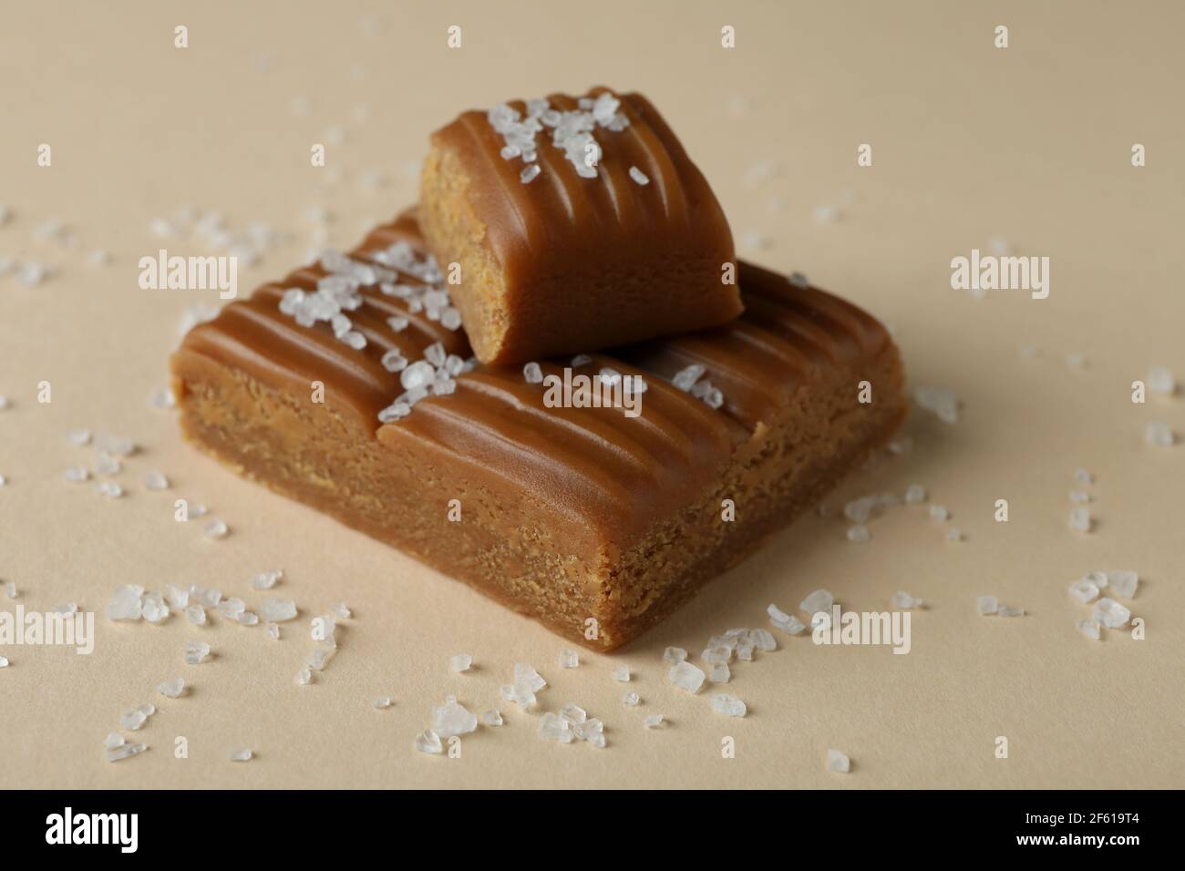 Delicious salted caramel on beige background, close up Stock Photo - Alamy