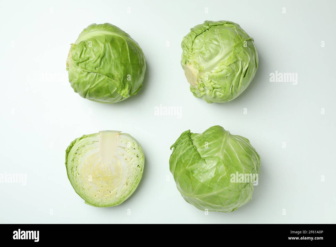 Flat lay with fresh cabbage on white background Stock Photo - Alamy