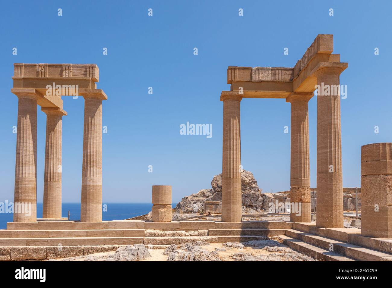 Destroyed ancient columns of the ancient city of Lindos, Rhodes, Greece ...