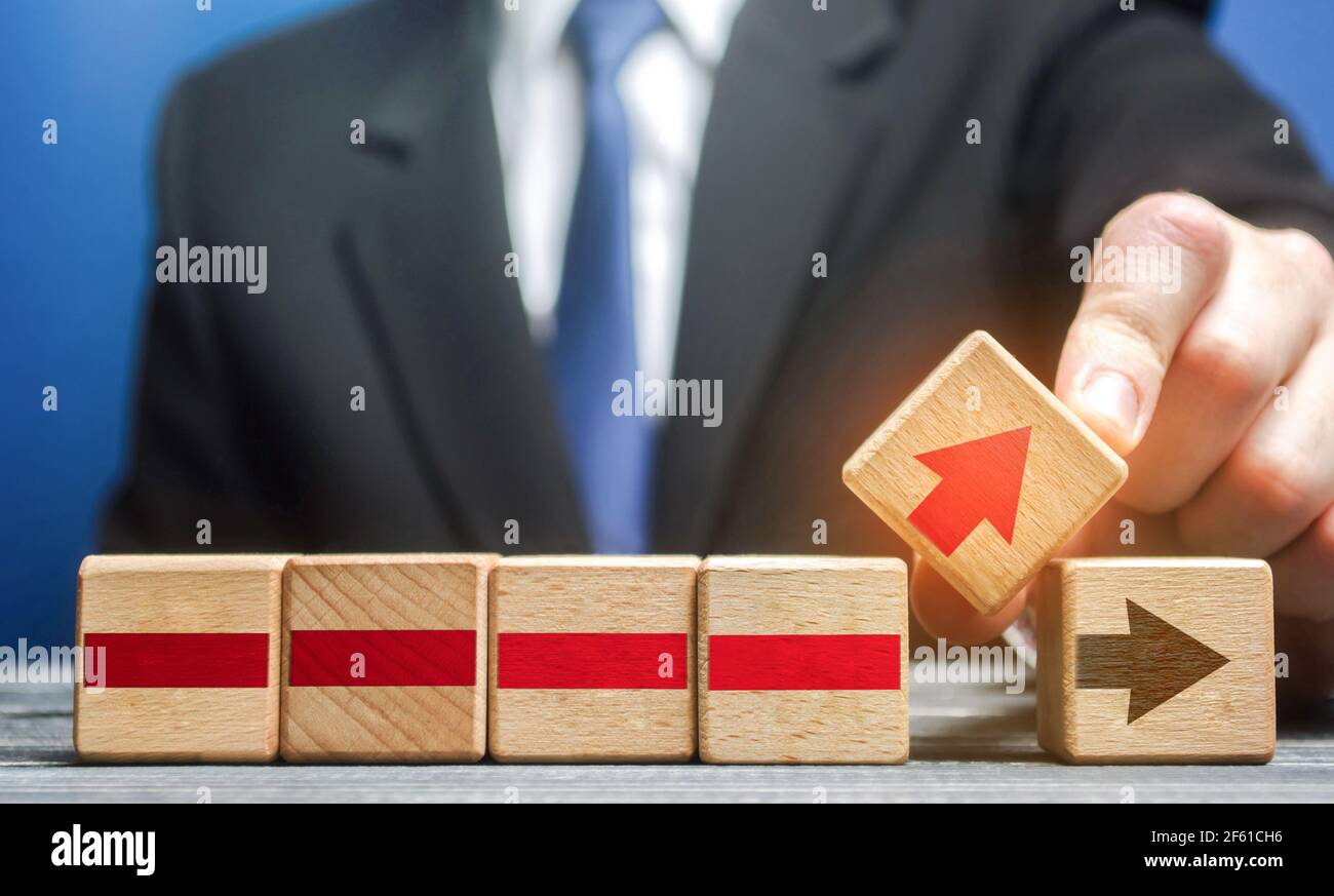 Businessman makes changes to the business process on an alternative ...