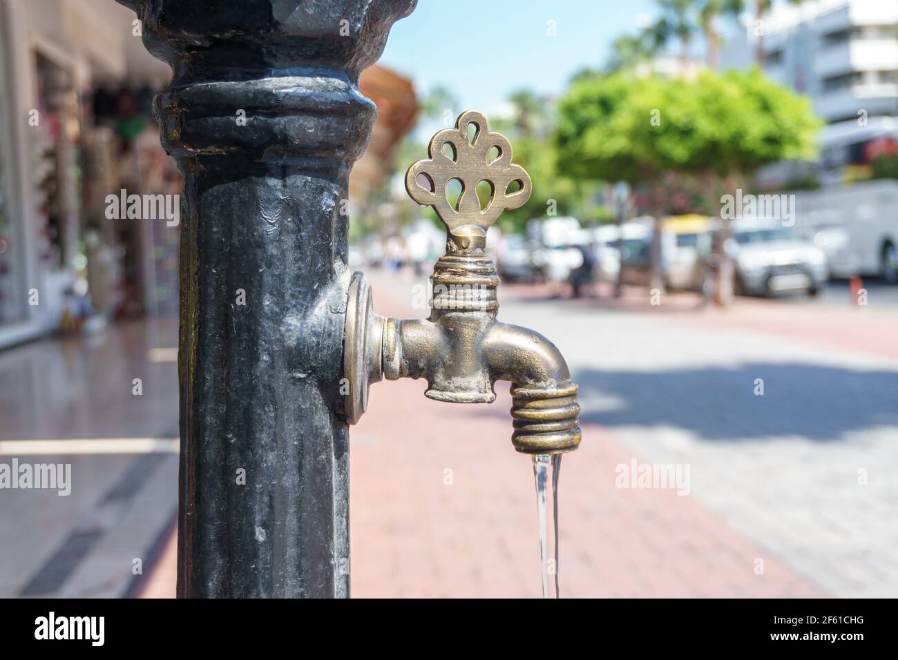 A tap with drinking water on the street. Water flows from the tap Stock ...