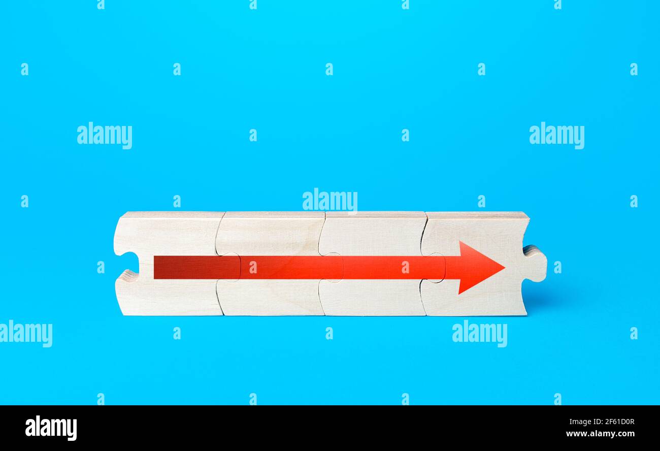 Assembled puzzle with a red arrow. Continuation of process, further ...