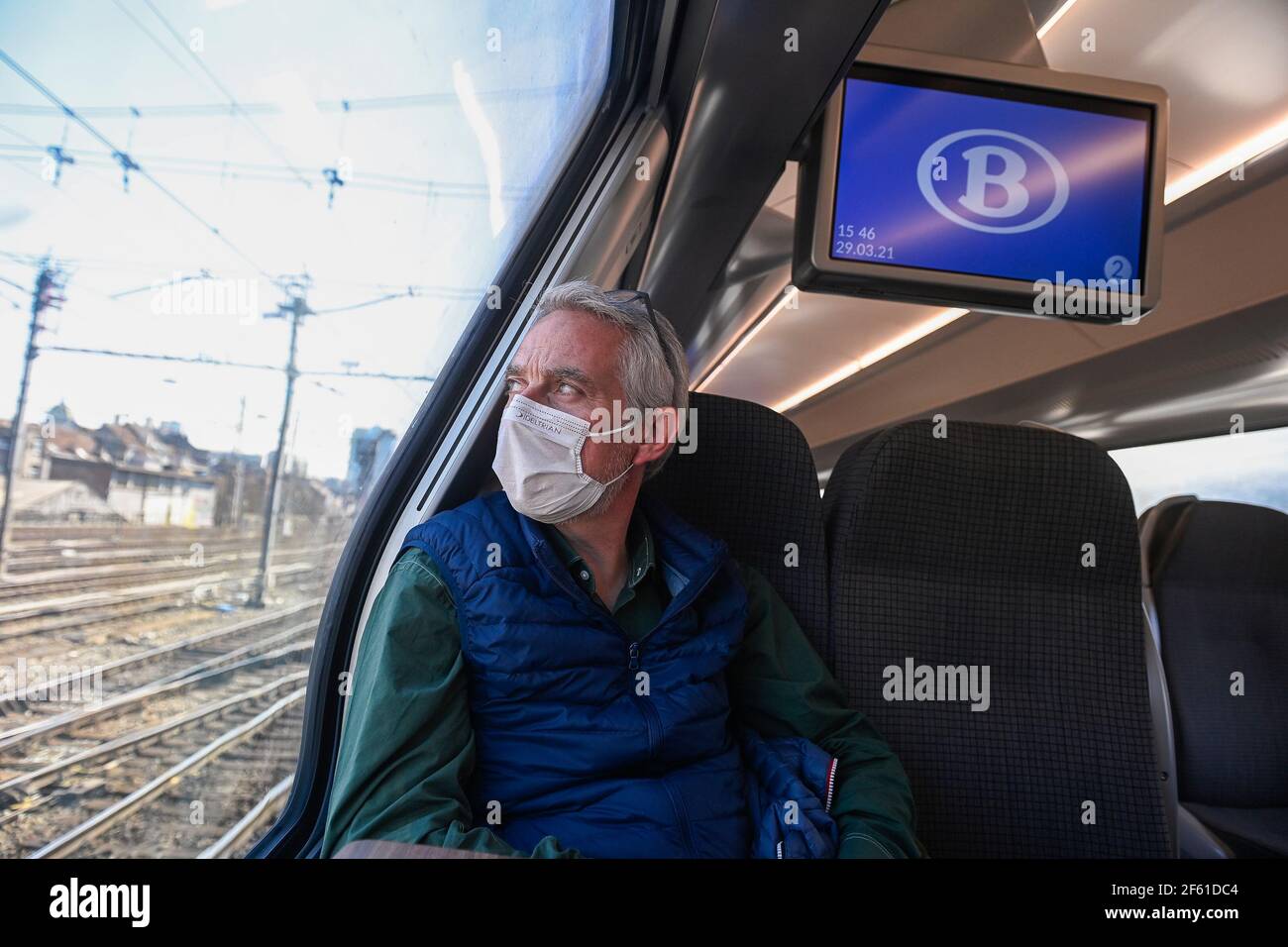 Illustration picture shows a person sitting by the window, in a train ...