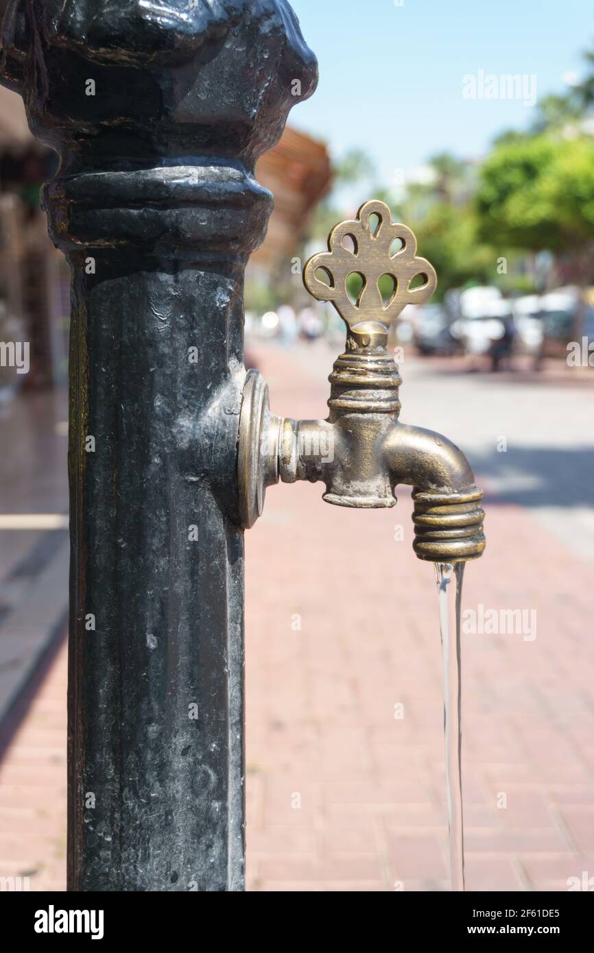 A tap with drinking water on the street. Water flows from the tap Stock ...