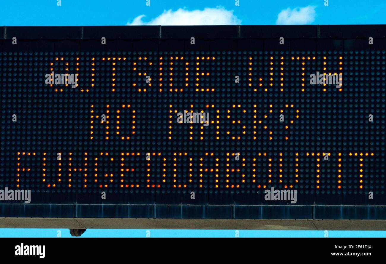 Traffic Sign: "Outside With No Mask? Fuhgeddaboutit Stock Photo - Alamy