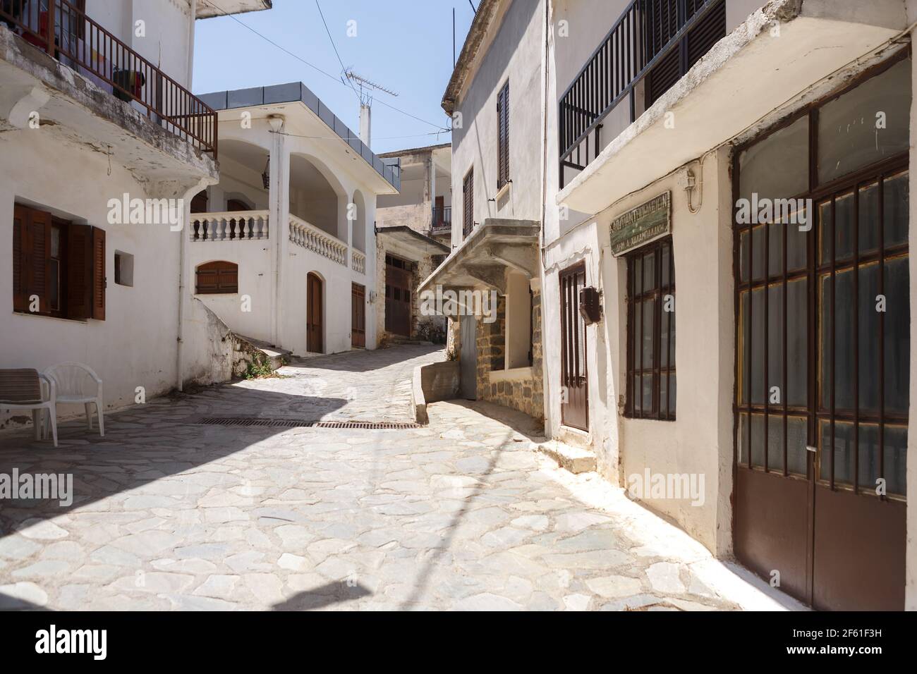 A typical street in a Greek village. Old houses. Crete, Greece Stock ...