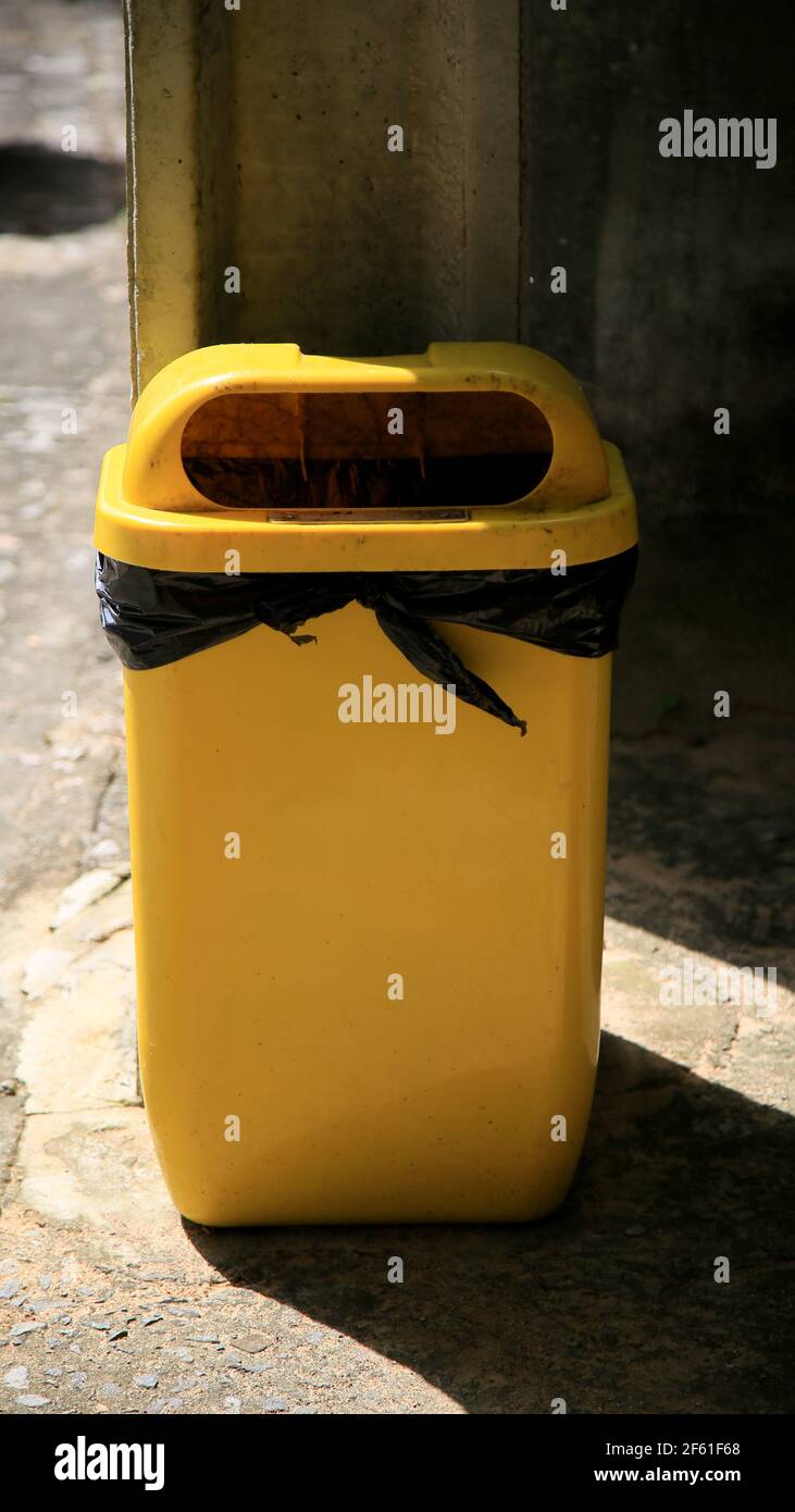 salvador, bahia / brazil - july 2, 2020: yellow trash can is seen in a ...
