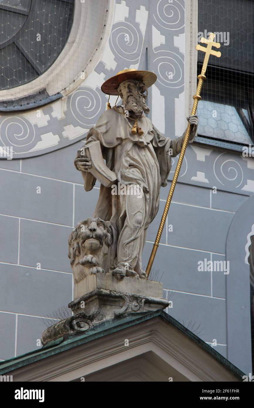 statue of a holy character on the facade of the franziskanerkirche ...