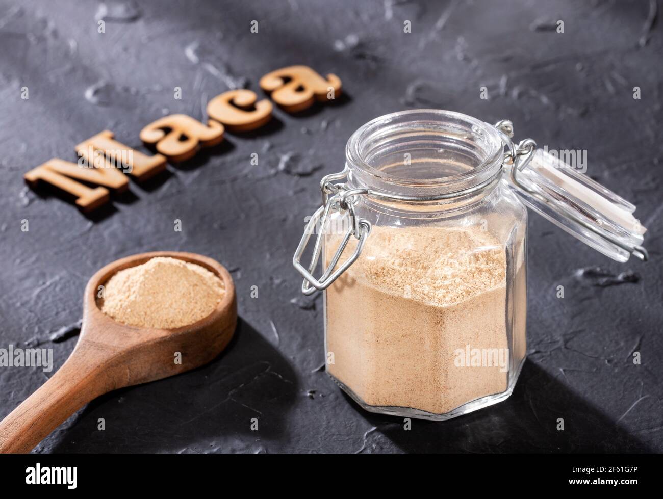 Word maca in wooden letters - Dry Organic Maca Powder. Lepidium meyenii ...