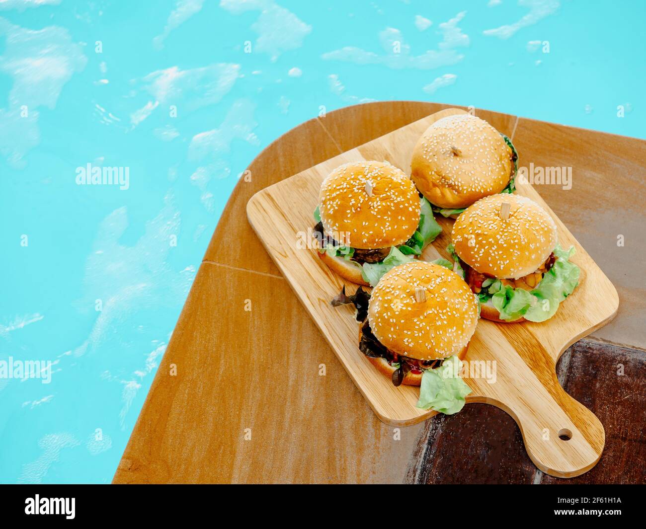 Family of four swimming pool hi-res stock photography and images - Alamy