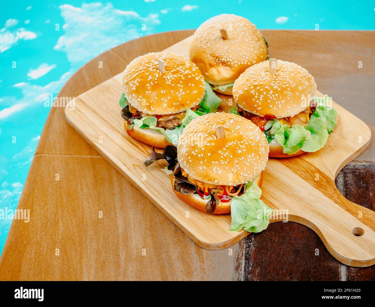 Family of four swimming pool hi-res stock photography and images - Alamy