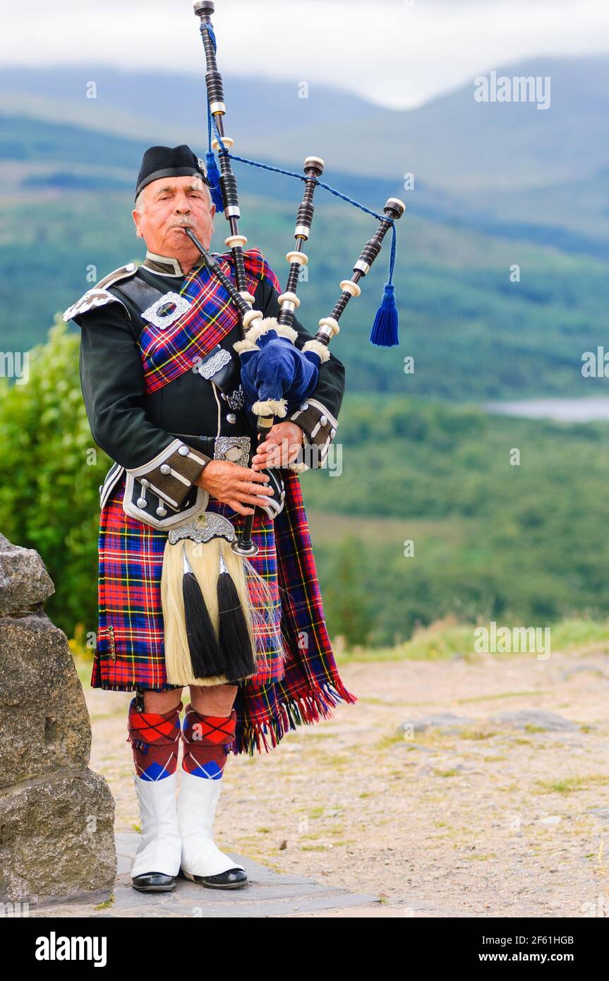 Man playing bag pipes in traditional custome, Scotland Stock Photo - Alamy