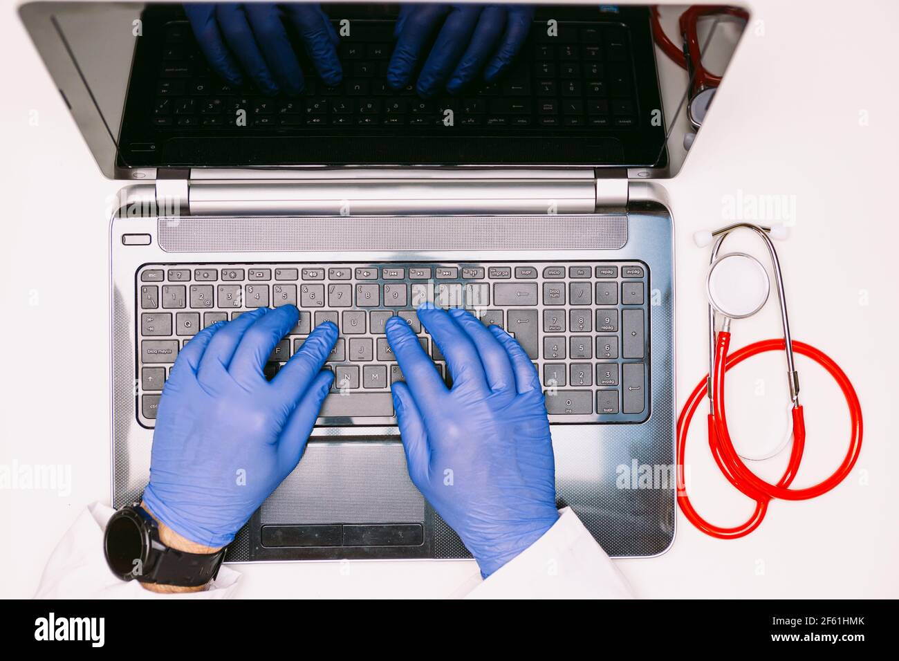Computer keyboard hands gloves typing hi-res stock photography and ...
