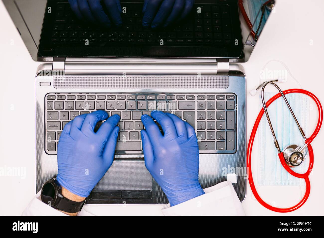 Computer keyboard hands gloves typing hi-res stock photography and ...