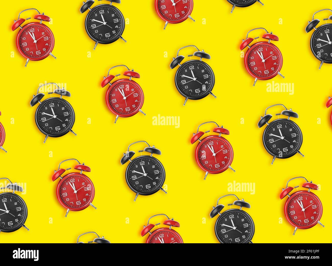 Many alarm clocks on color background Stock Photo - Alamy