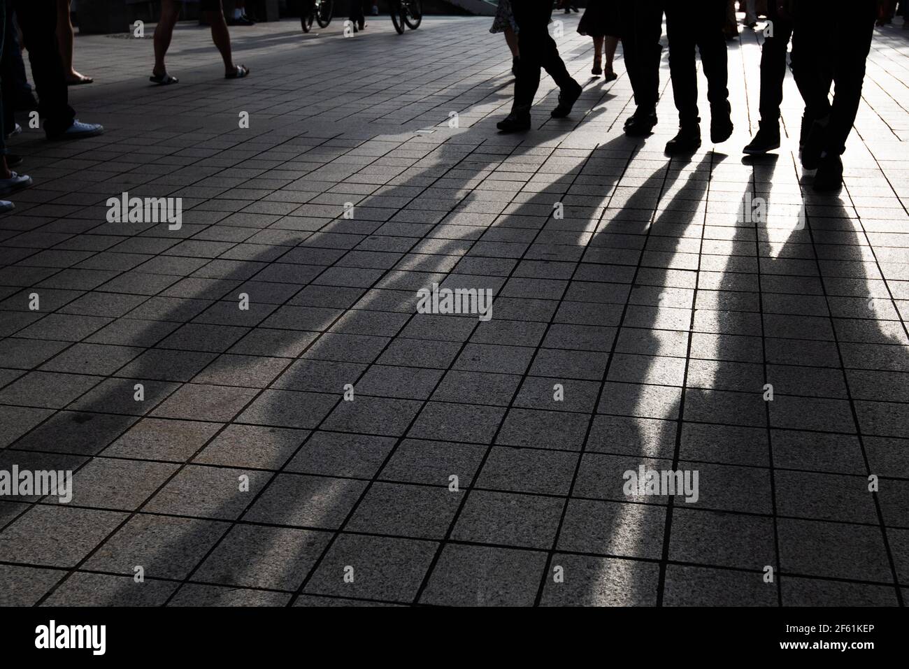 Silhouette of unrecognized people walking in the street Stock Photo - Alamy