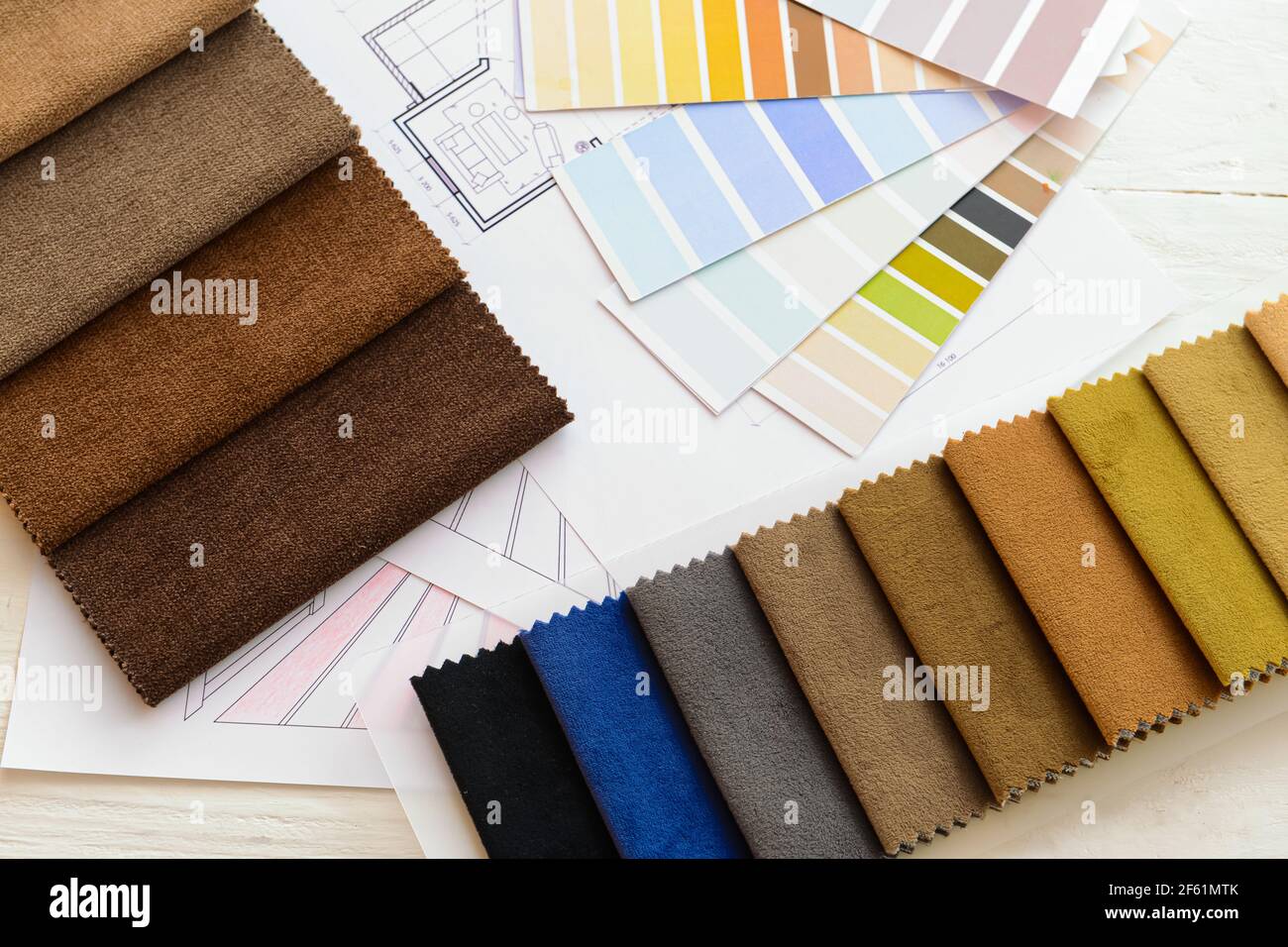 House plans, color palettes and fabric samples on wooden background ...