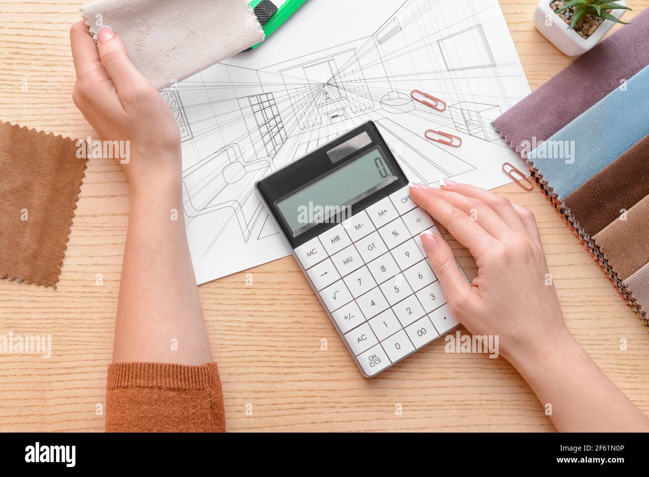 Interior designer woman calculator hi-res stock photography and images ...