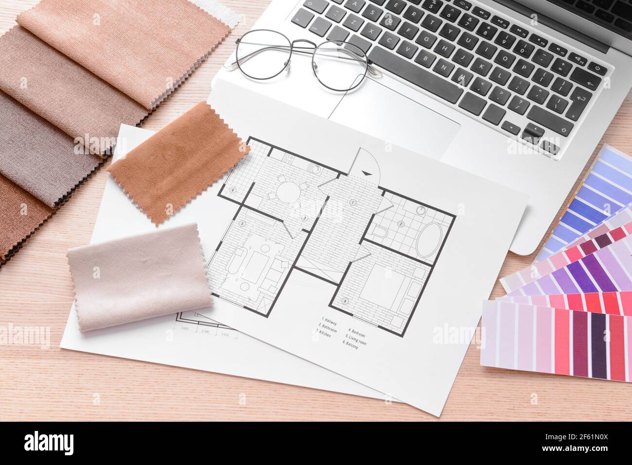 House plans, color palettes and fabric samples on wooden background ...