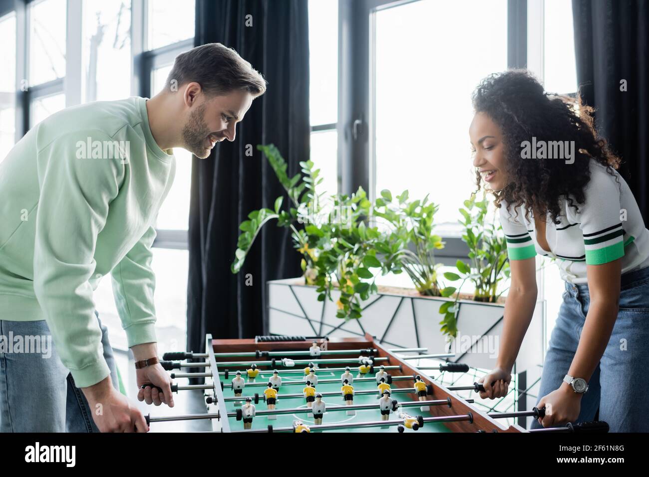 Playing table football in office hi-res stock photography and images ...