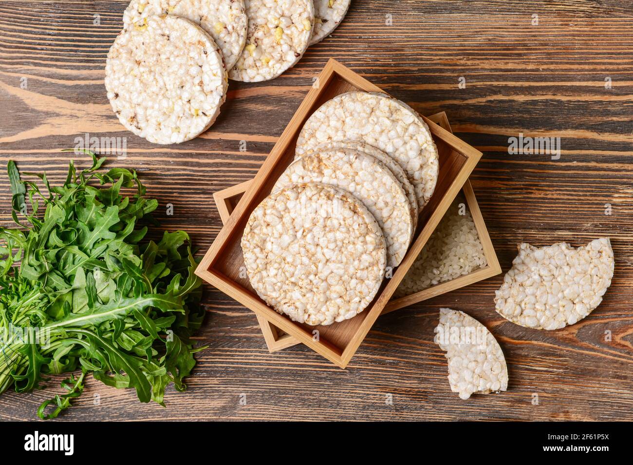 Box with rice crackers on wooden background Stock Photo - Alamy