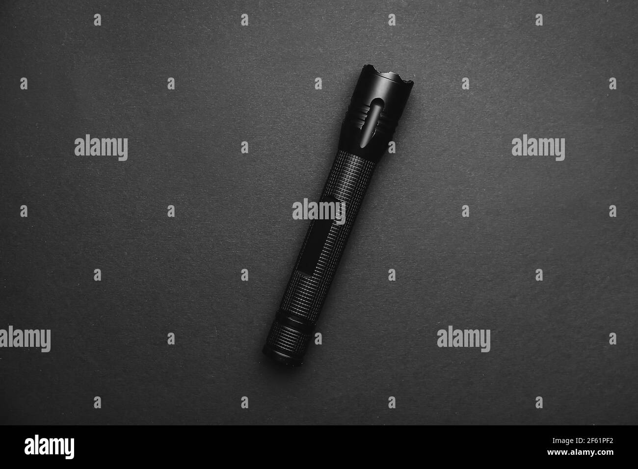 Modern flashlight on dark background Stock Photo - Alamy